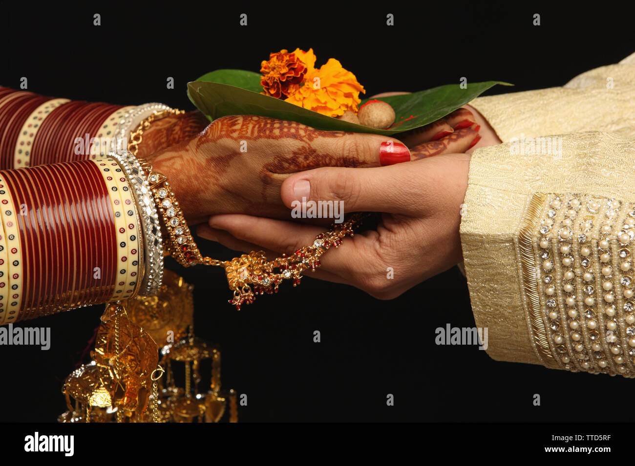 Newlywed couple performing traditional ritual Stock Photo - Alamy