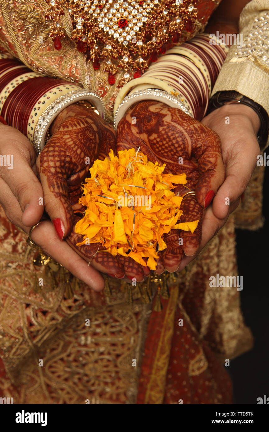 Newlywed couple performing traditional ritual Stock Photo - Alamy