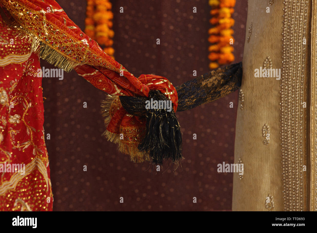 Newlywed couple performing traditional ritual Stock Photo - Alamy