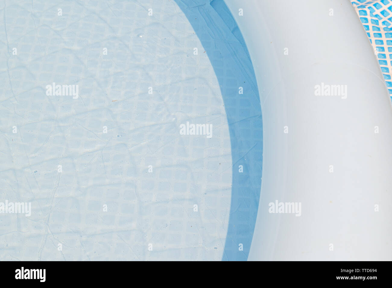 A round, blue, garden pool for children Stock Photo - Alamy