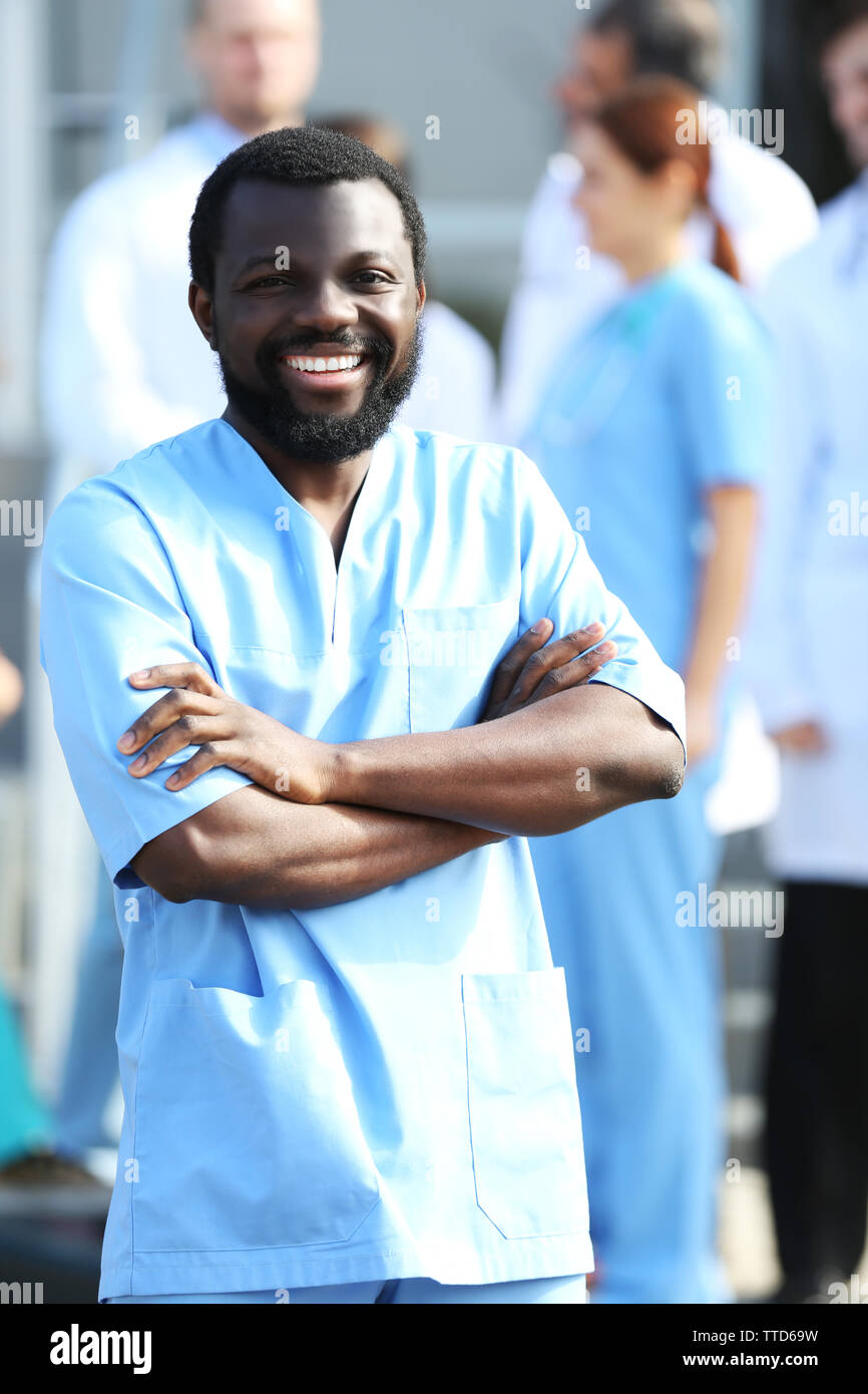 Portrait of an handsome smiling doctor Stock Photo - Alamy