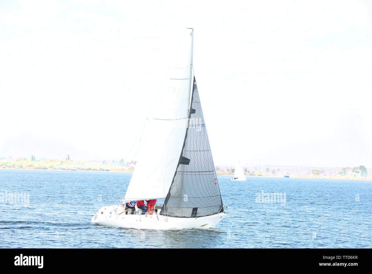 Sailing yacht on river Stock Photo - Alamy
