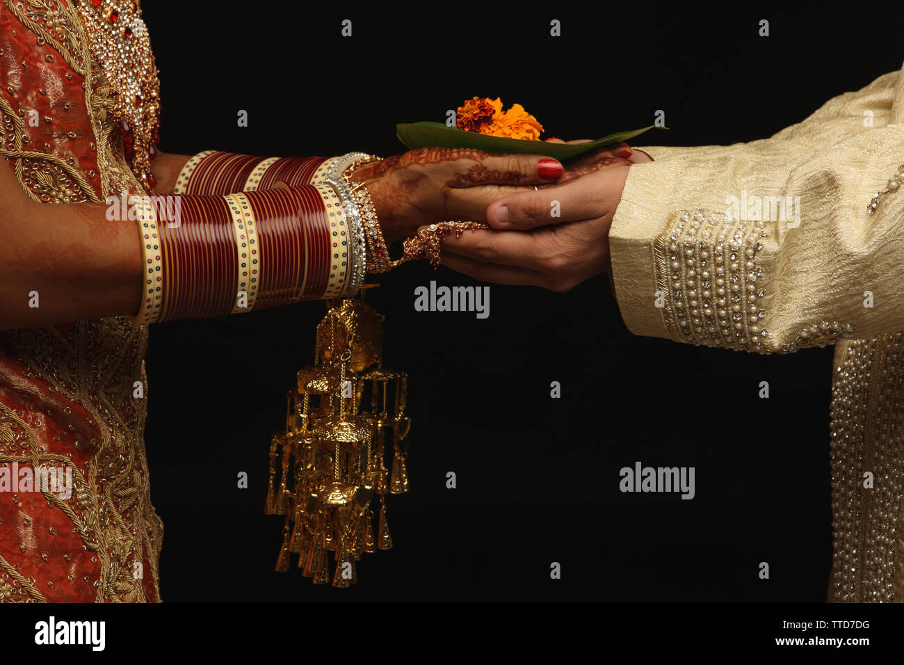 Newlywed couple performing traditional ritual Stock Photo - Alamy