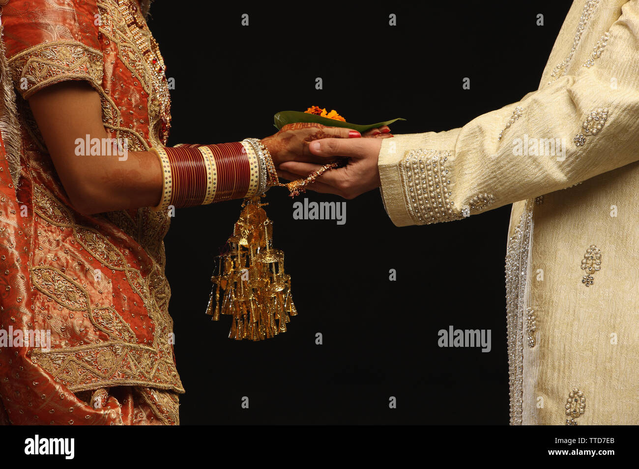 Newlywed Indian couple performing traditional ritual Stock Photo - Alamy