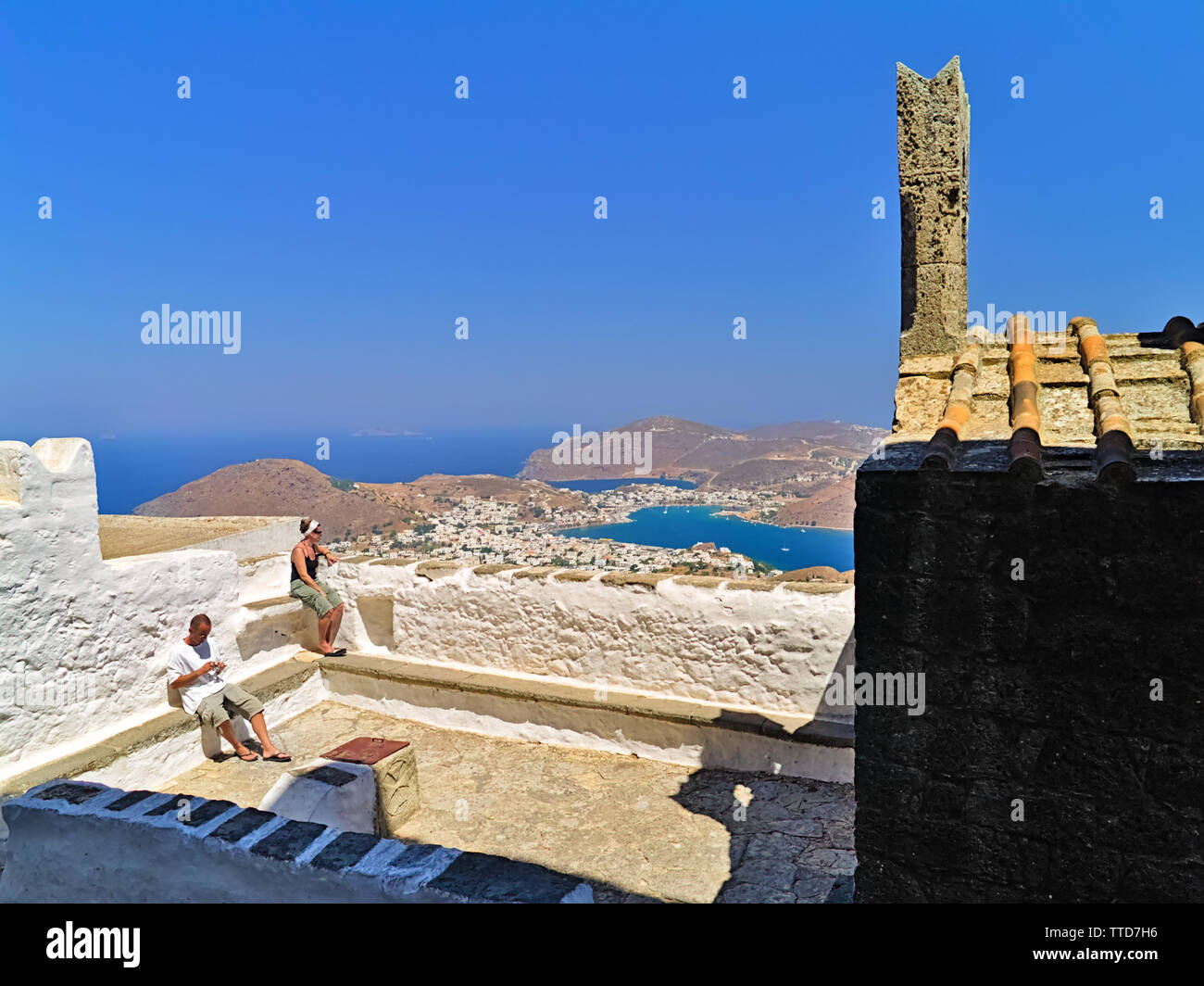 Patmos island, Greece, tourists one man one woman in front of chapel at ...