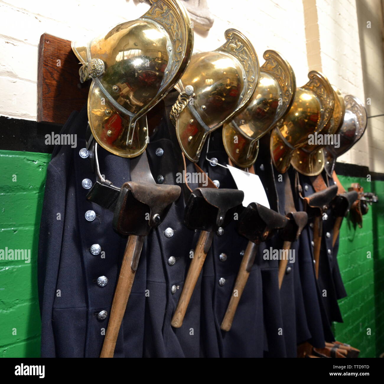 Antique firefighters' helmets and axes. The Greater Manchester Fire ...