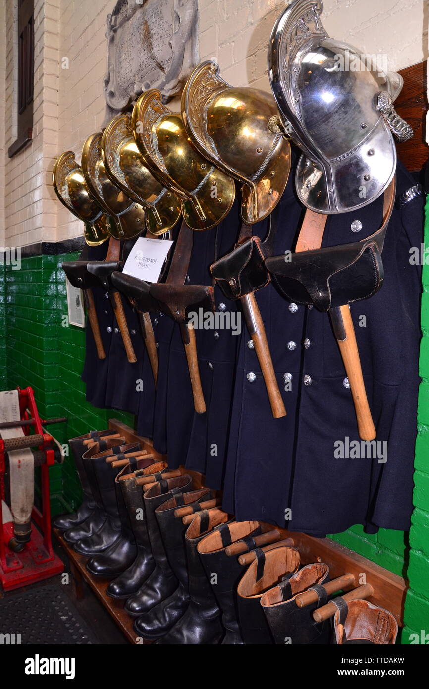 Antique firefighters' helmets and axes. The Greater Manchester Fire ...