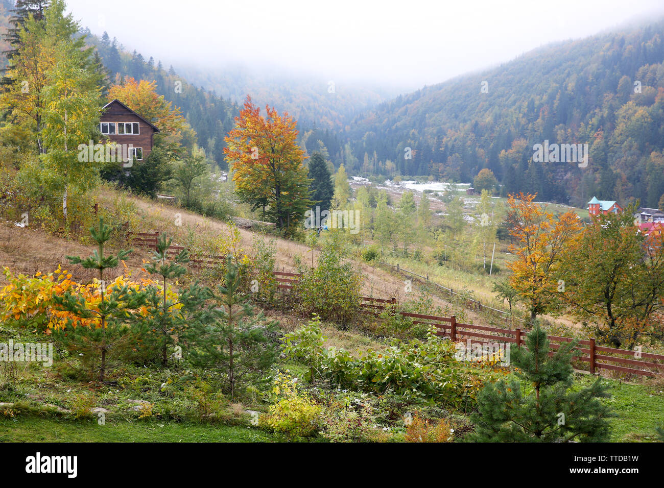 Landscape of village in mountains Stock Photo - Alamy