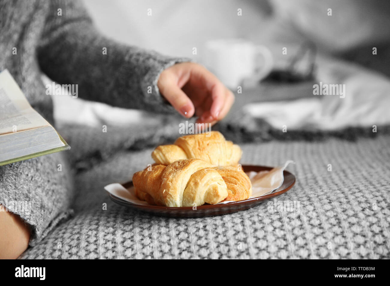 Girl with light breakfast on bed Stock Photo - Alamy