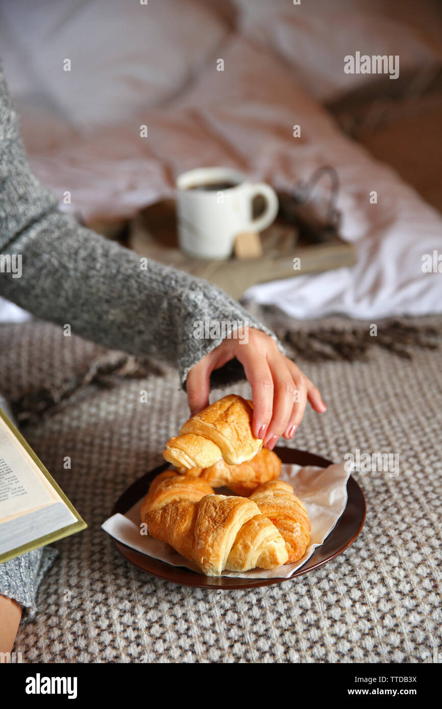 Girl with light breakfast on bed Stock Photo - Alamy