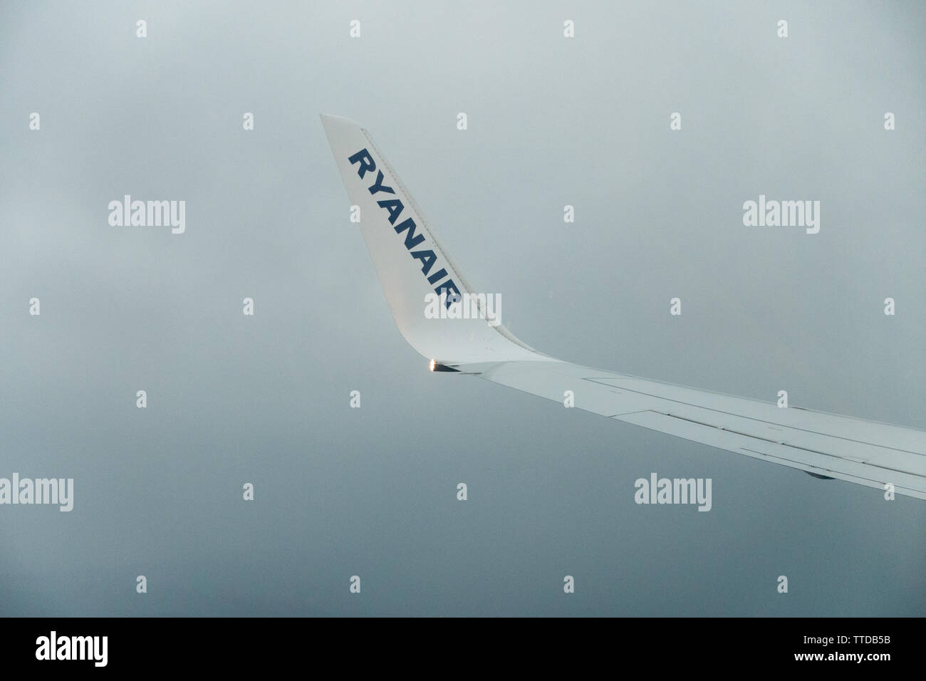 view showing the wing tip of a ryanair passenger Boeing 737 jet whilst ...