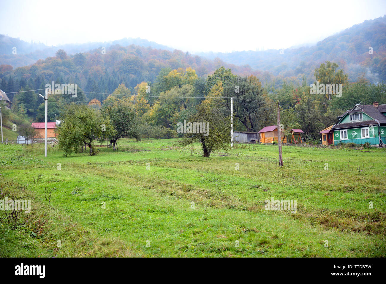 Landscape of village in mountains Stock Photo - Alamy