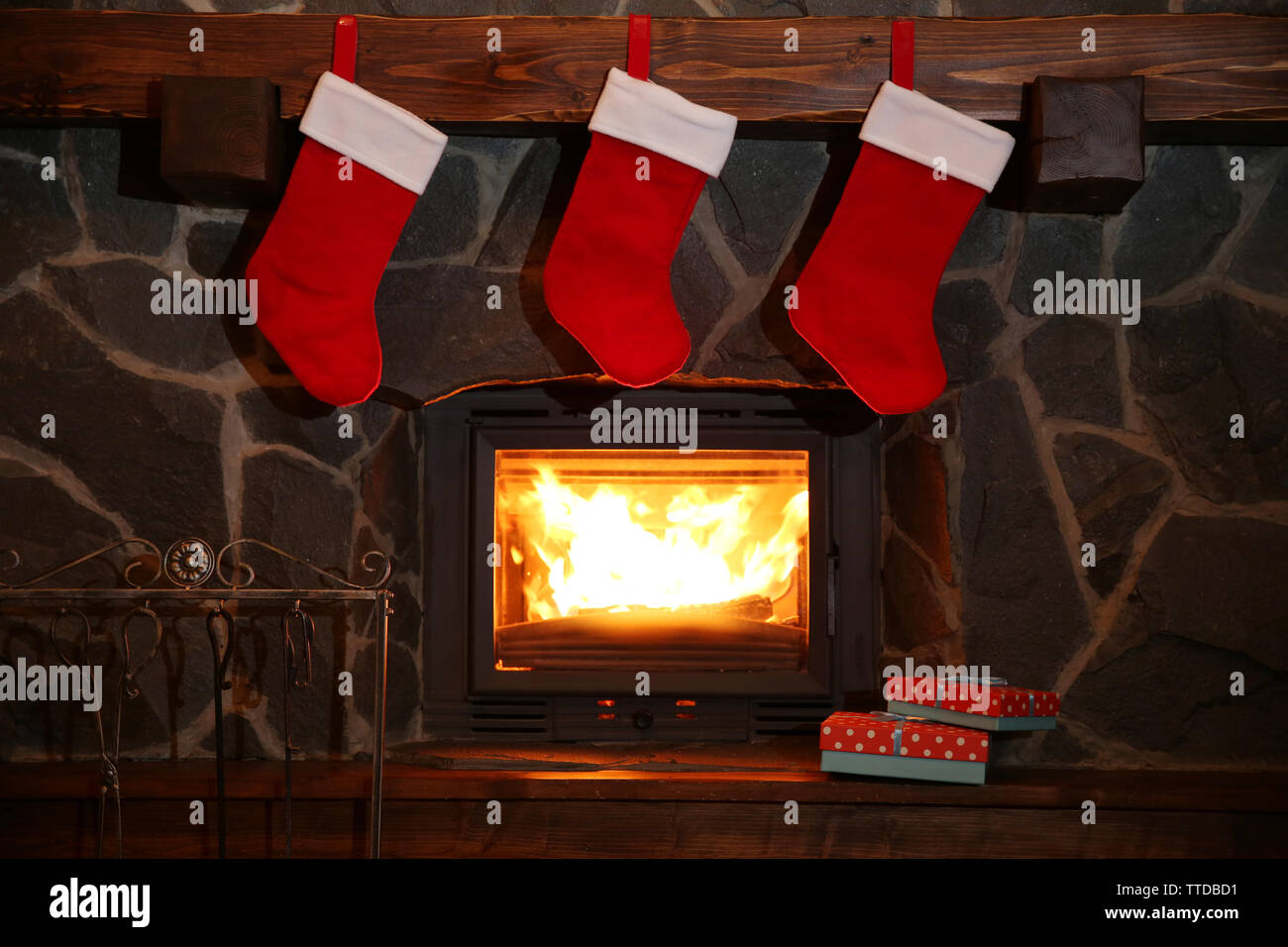 Christmas stockings hanging on fireplace hi-res stock photography and ...