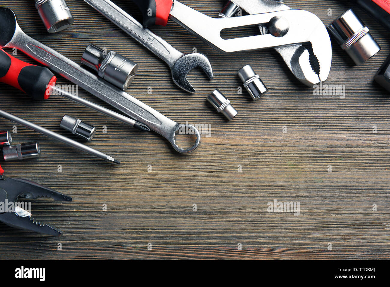 Different kinds of tools on wooden background, top view Stock Photo - Alamy