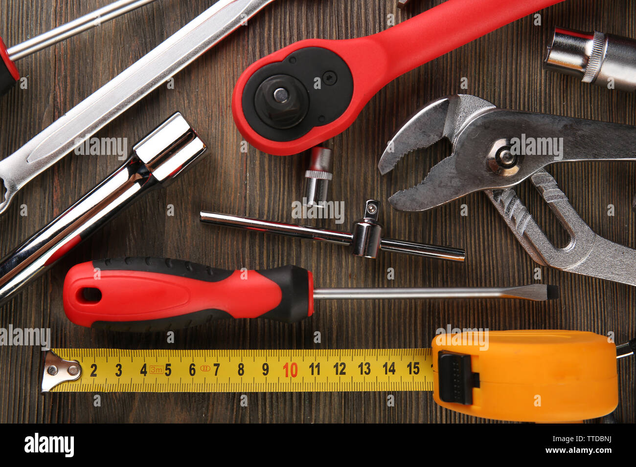 Different kinds of tools on wooden background, top view Stock Photo - Alamy