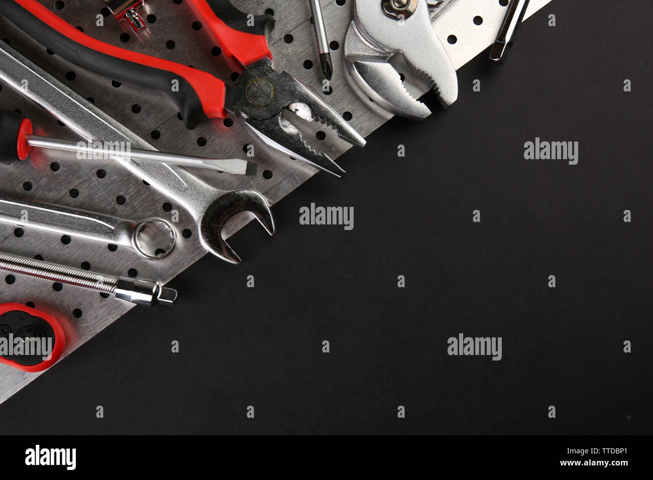 Different kinds of tools on dark background Stock Photo - Alamy