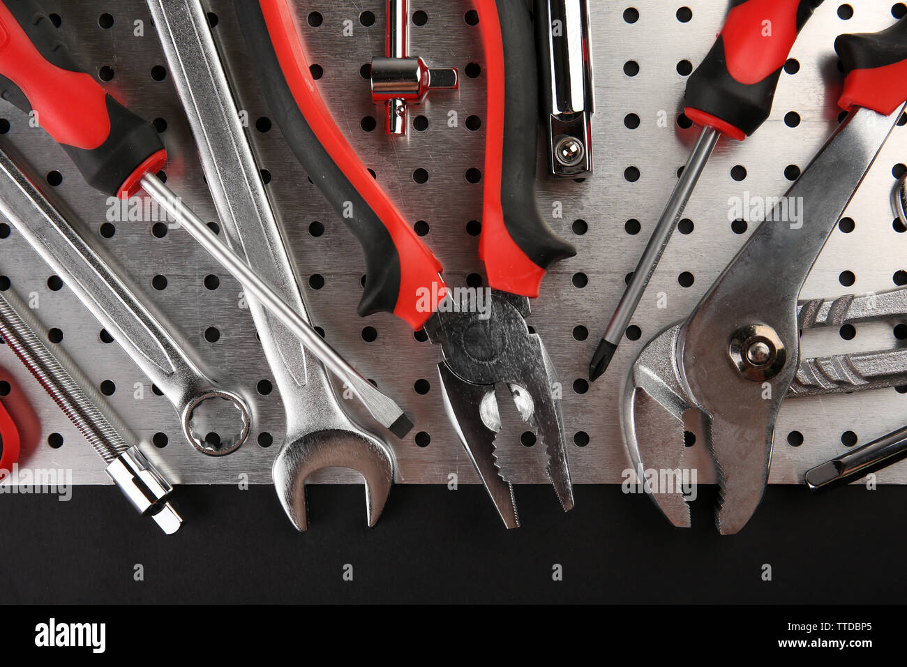 Different kinds of tools on dark background Stock Photo - Alamy
