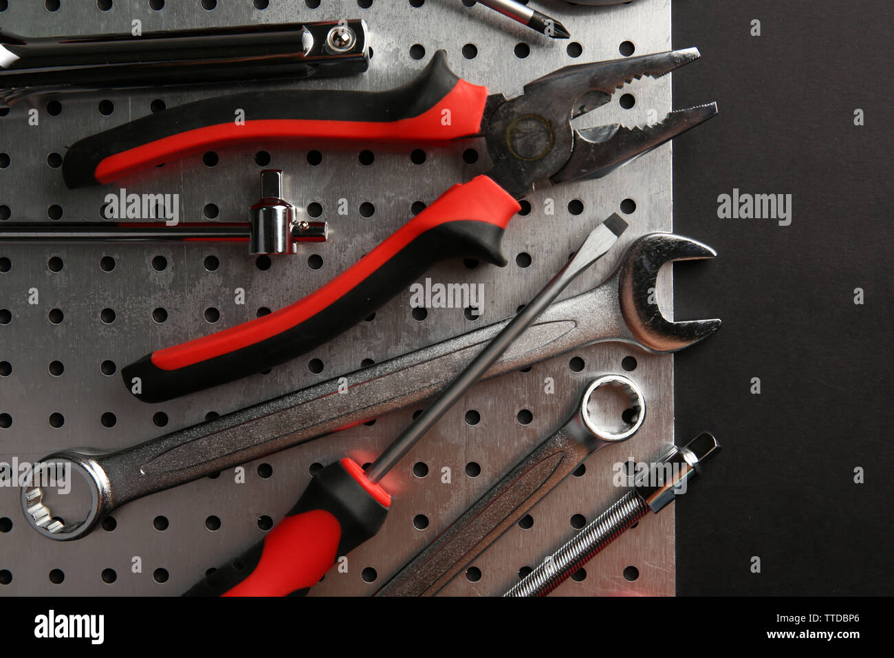 Different kinds of tools on dark background Stock Photo - Alamy