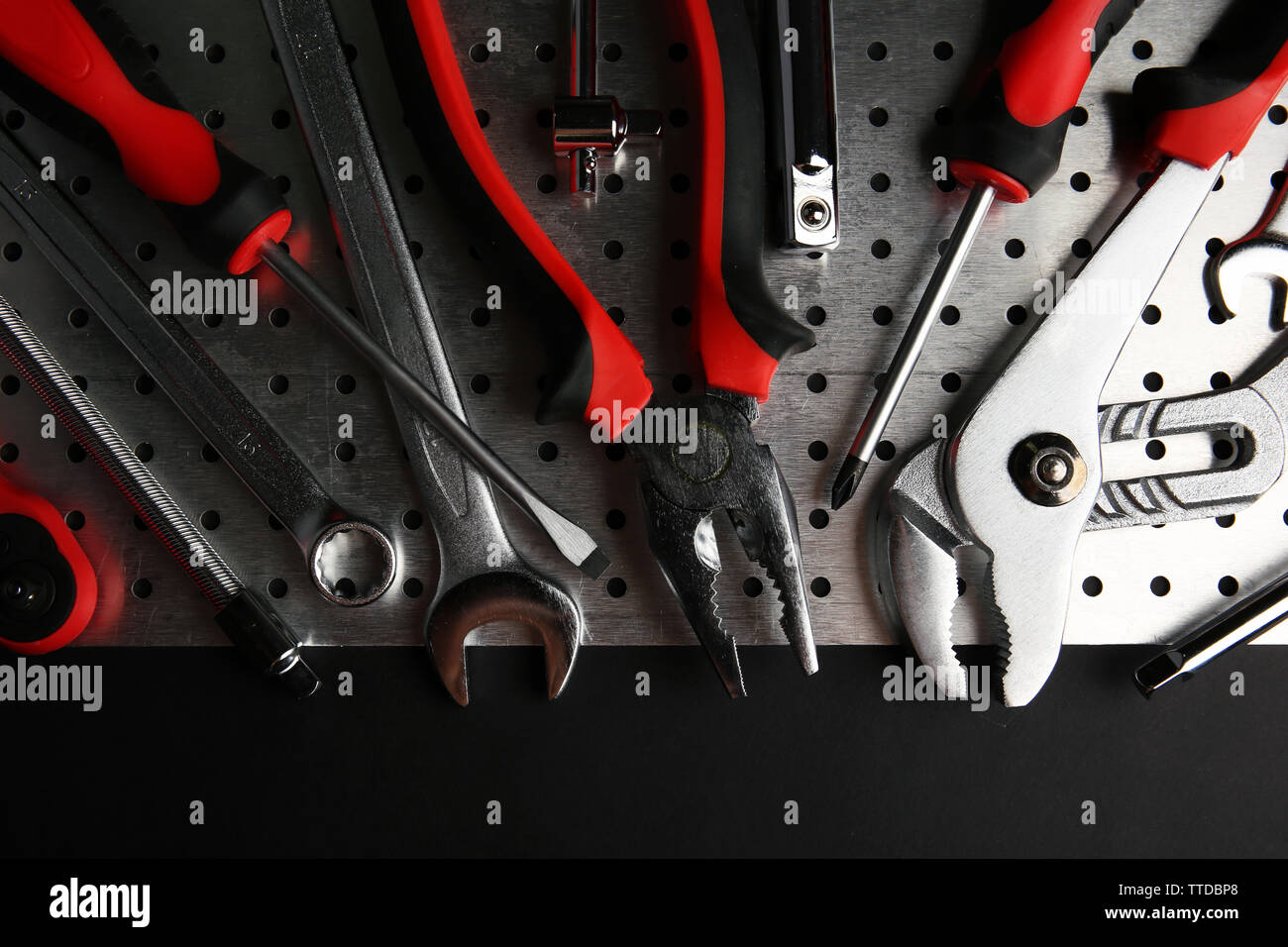Different kinds of tools on dark background Stock Photo - Alamy