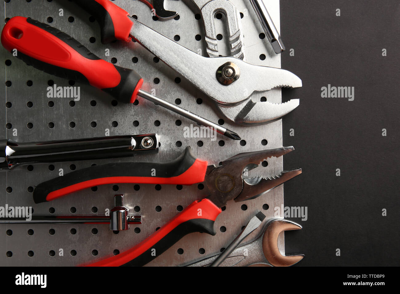 Different kinds of tools on dark background Stock Photo - Alamy