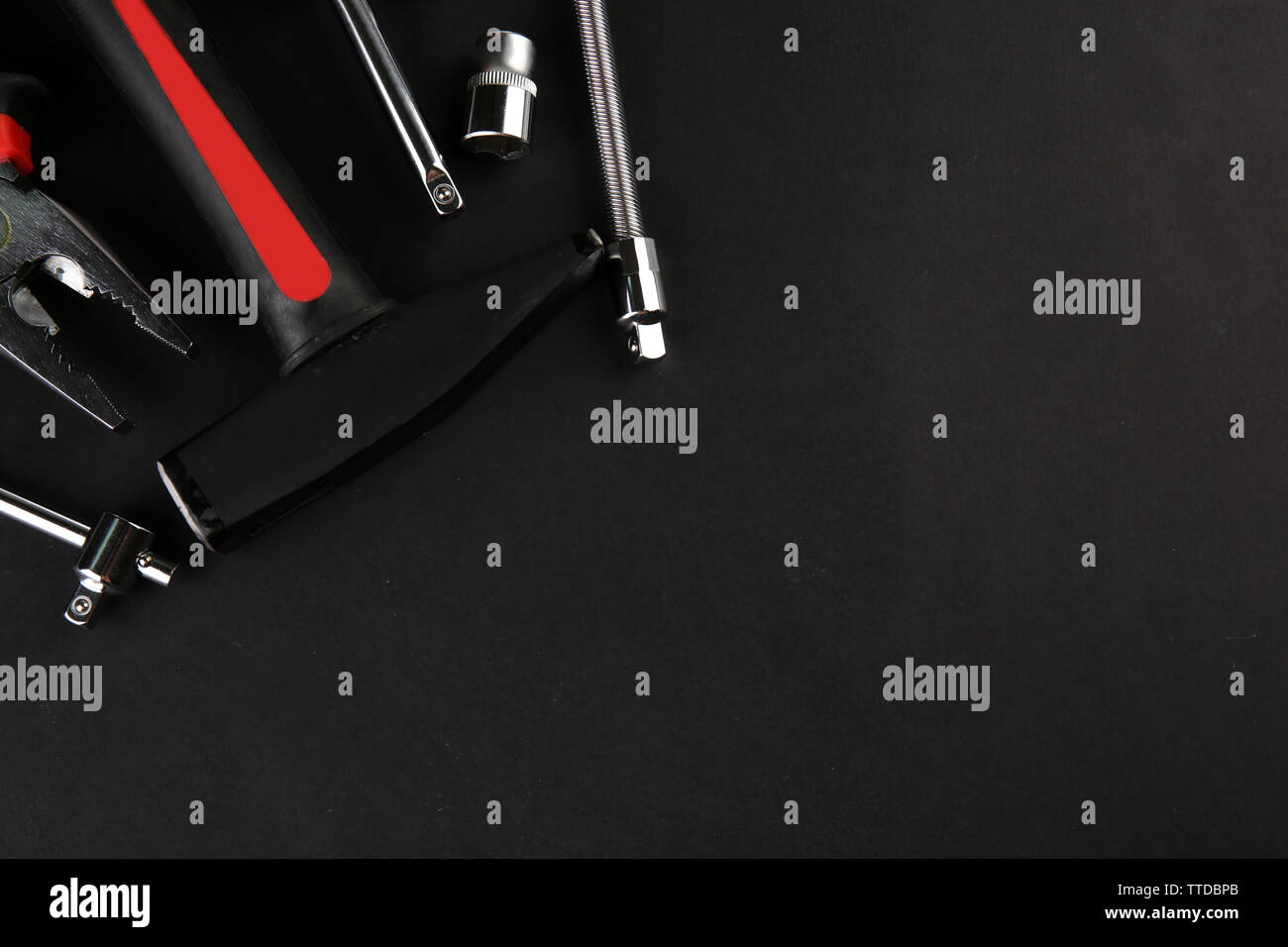 Different kinds of tools on dark background Stock Photo - Alamy
