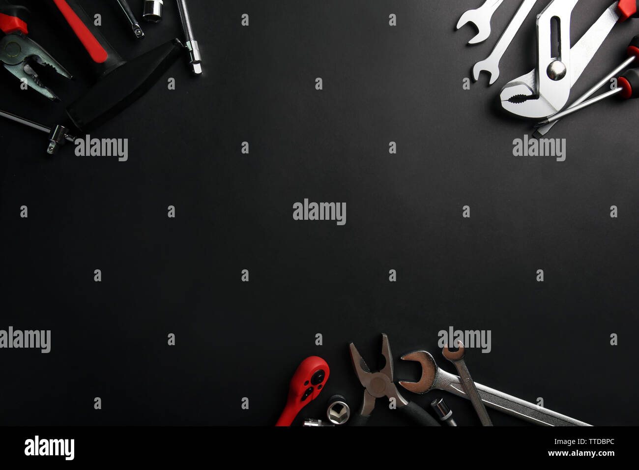 Different kinds of tools on dark background Stock Photo - Alamy