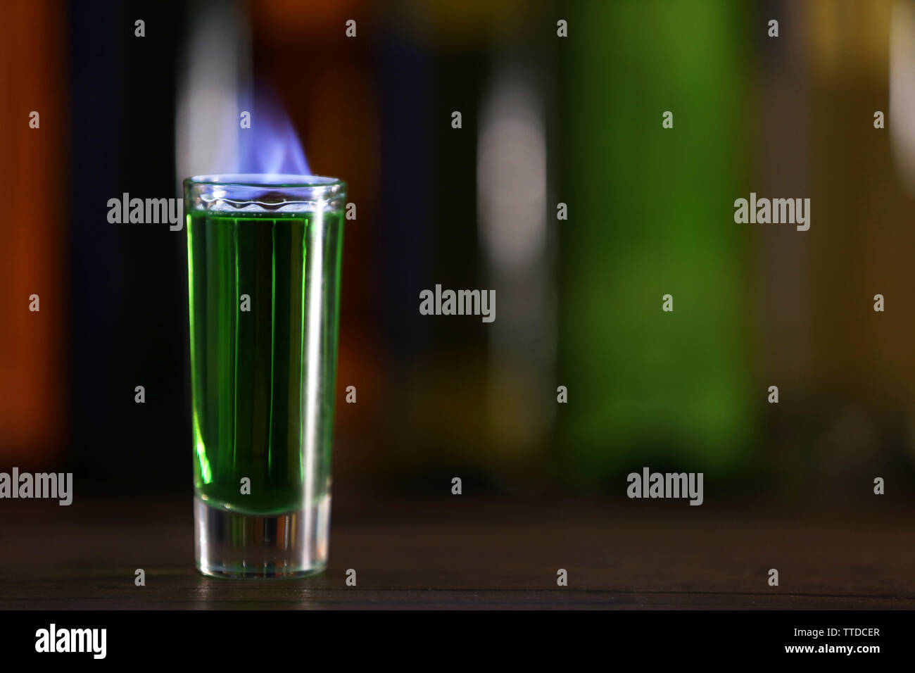 Burning cocktail on table in a bar Stock Photo - Alamy