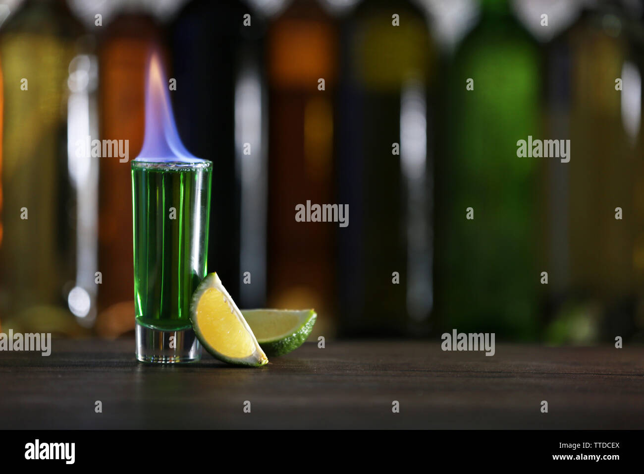 Burning cocktail on table in a bar Stock Photo - Alamy