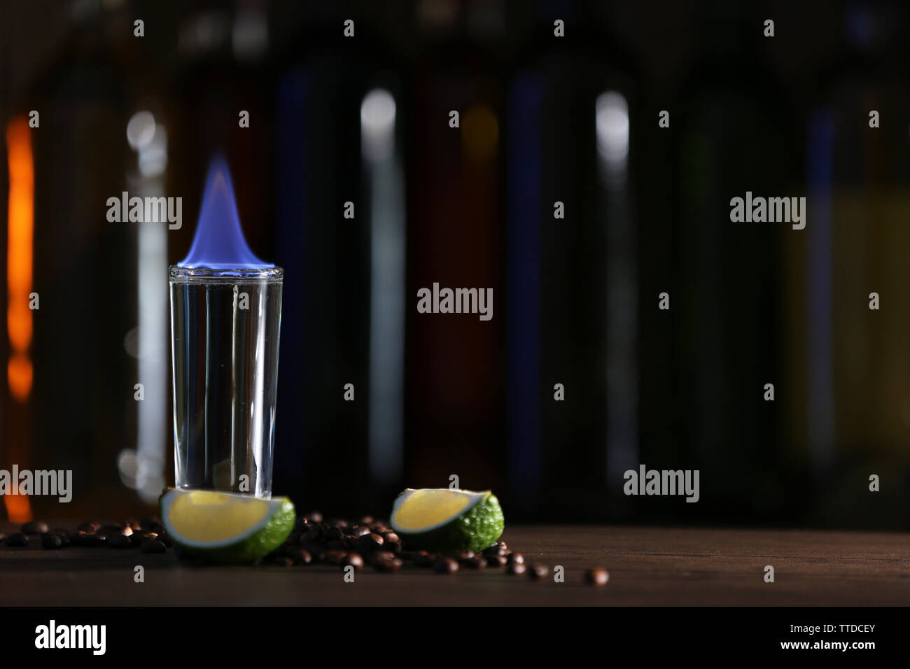 Burning cocktail on table in a bar Stock Photo - Alamy