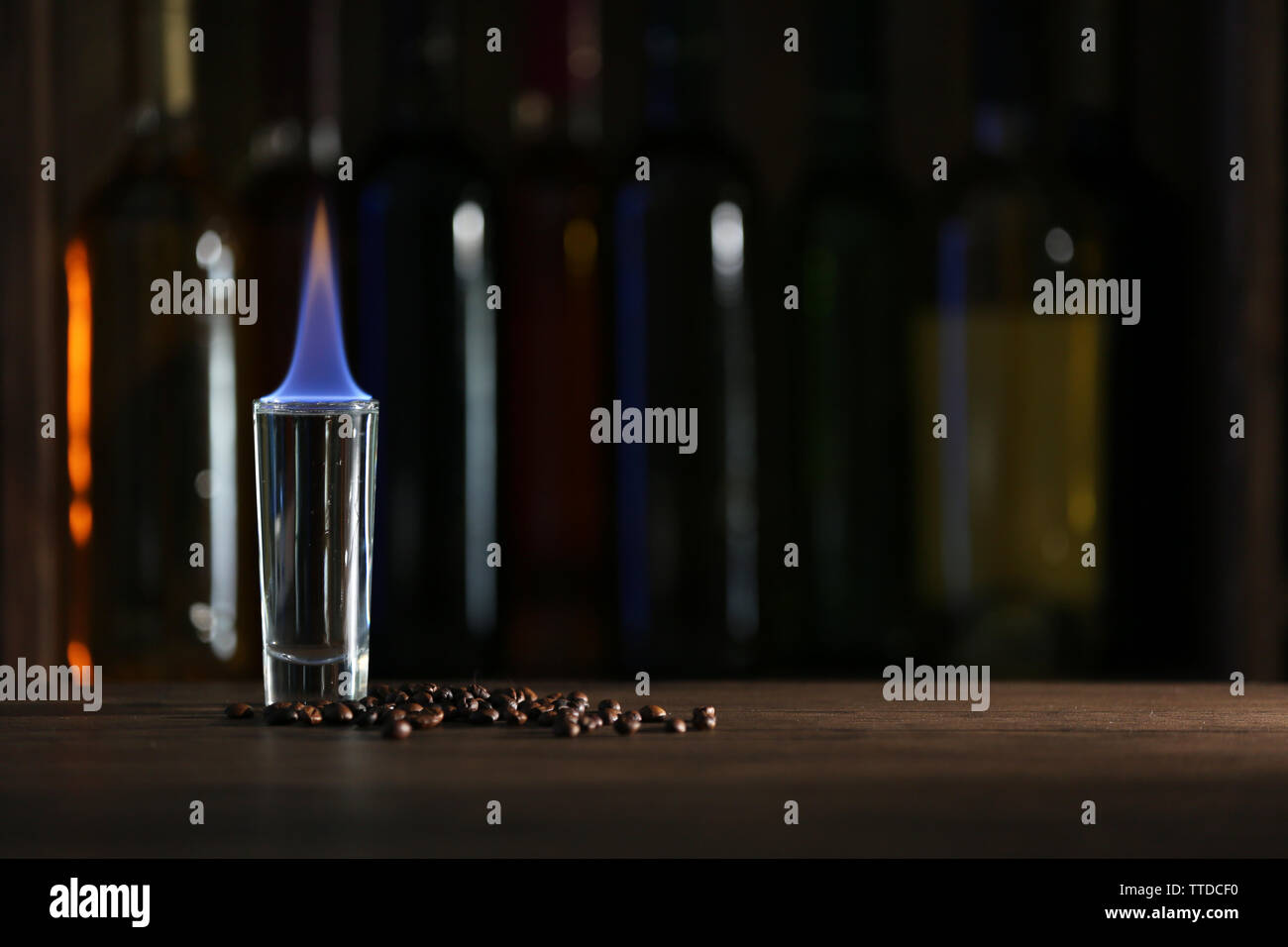 Burning cocktail on table in a bar Stock Photo - Alamy