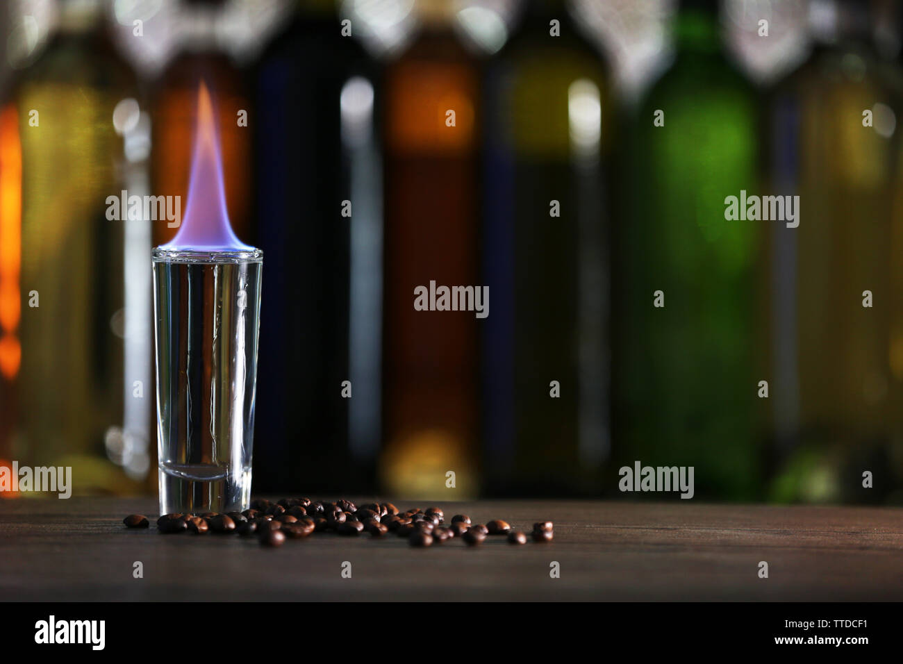 Burning cocktail on table in a bar Stock Photo - Alamy