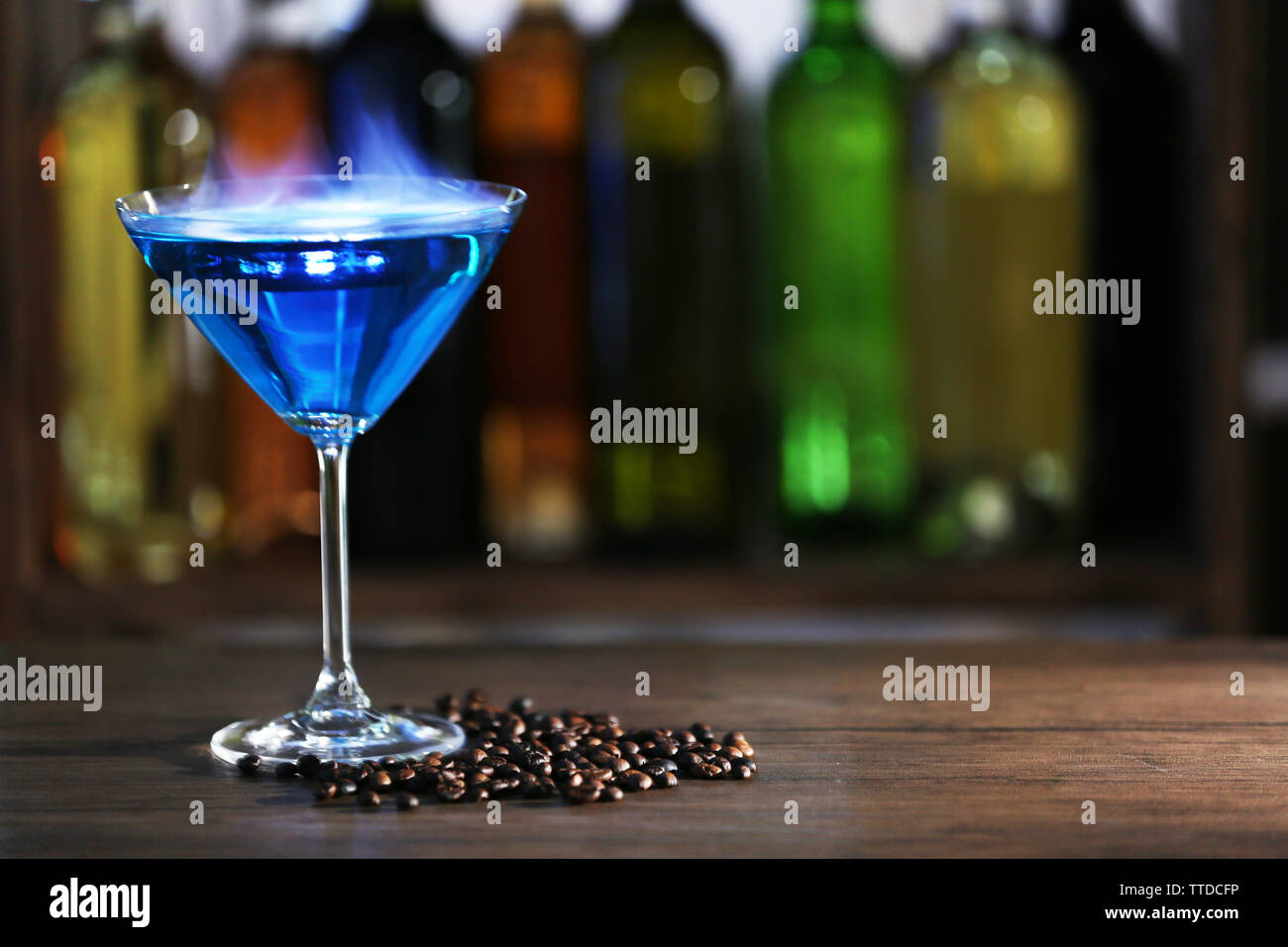 Burning cocktail on table in a bar Stock Photo - Alamy