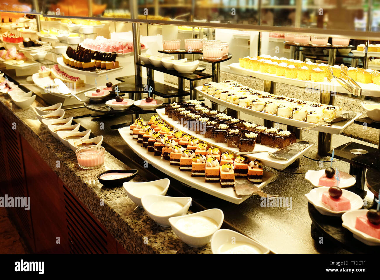 Different dessert cakes for sale at the shop Stock Photo - Alamy
