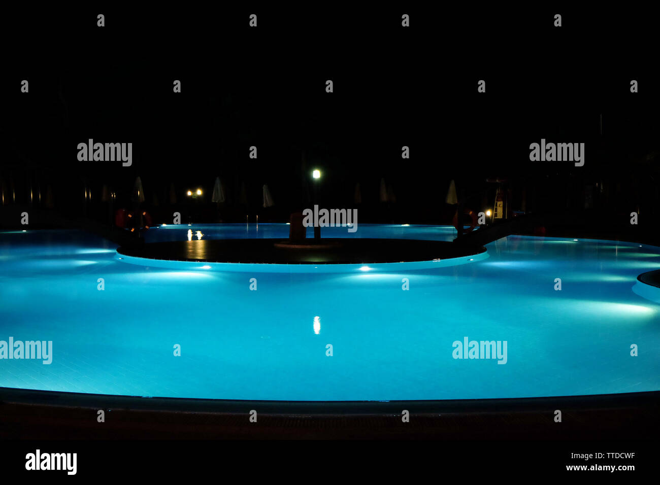 View on swimming pool at night Stock Photo - Alamy