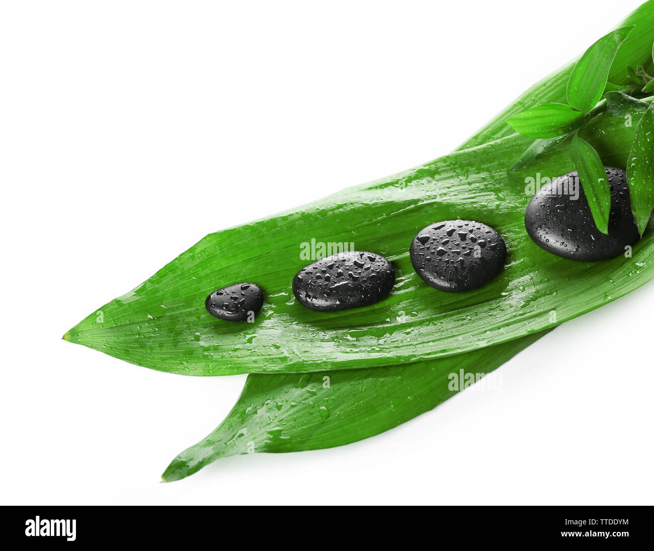 Hot spa stones with bamboo, isolated on white Stock Photo - Alamy