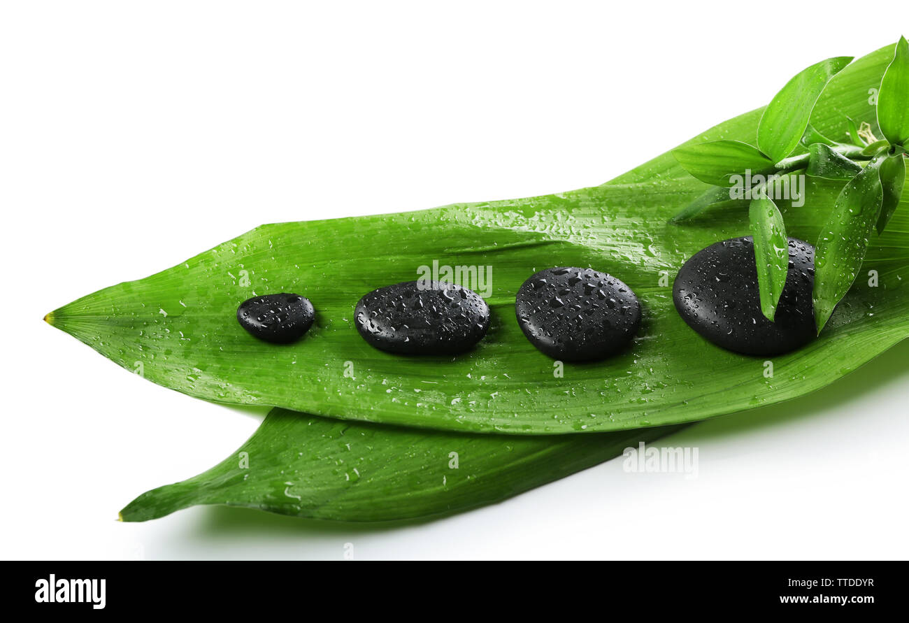 Hot spa stones with bamboo, isolated on white Stock Photo - Alamy