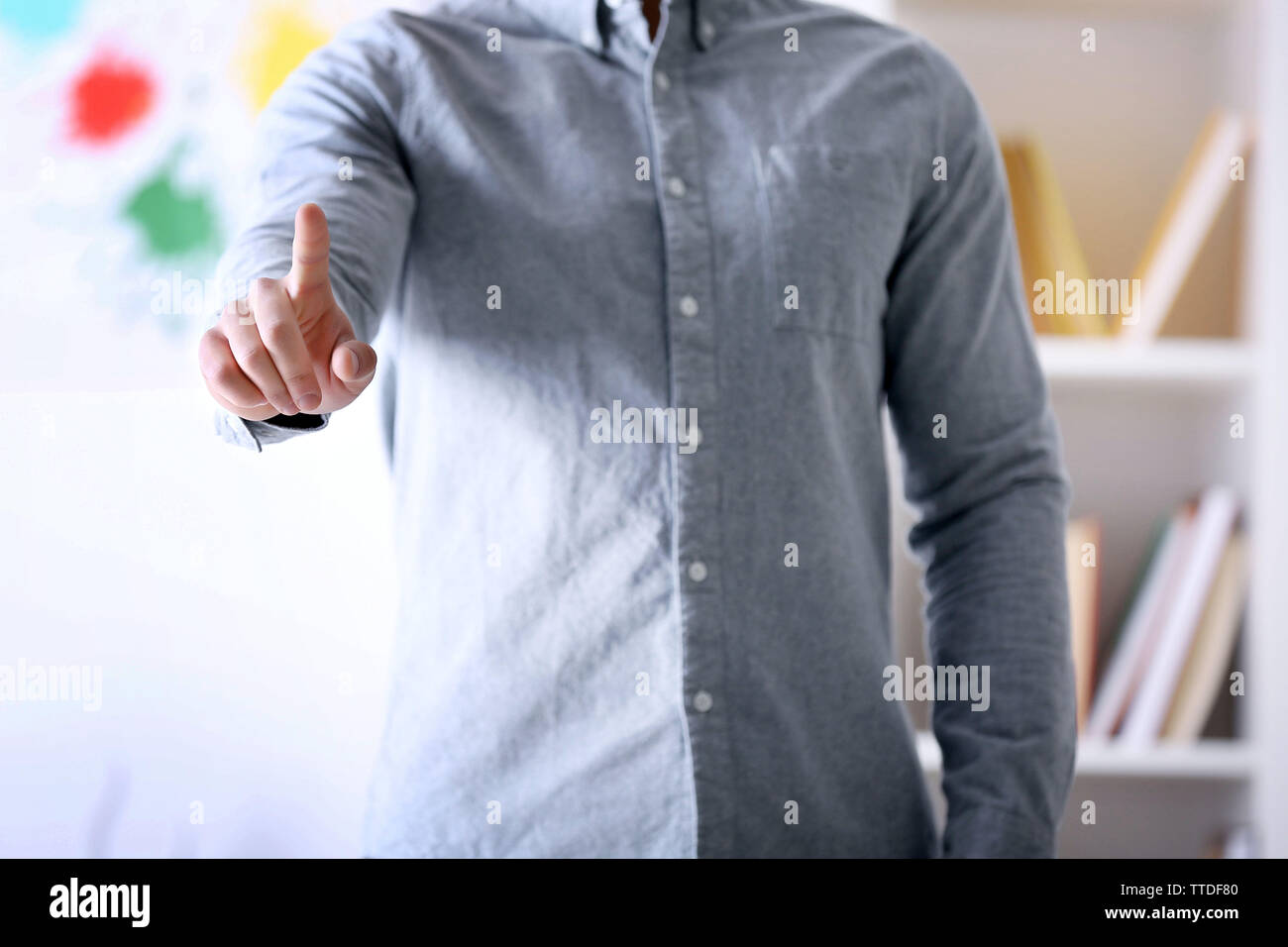 Young man push button Stock Photo - Alamy