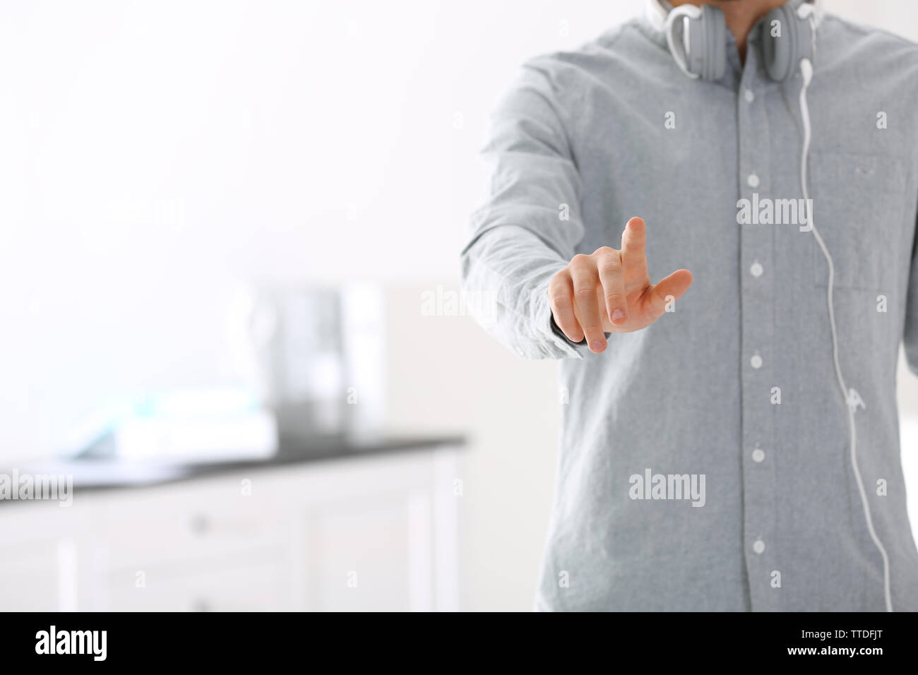 Young man push button Stock Photo - Alamy