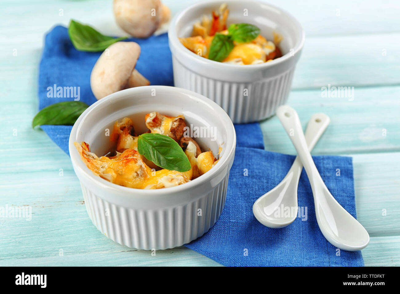 French dish julienne. Mushroom, chicken and cheese gratin in ceramic ...