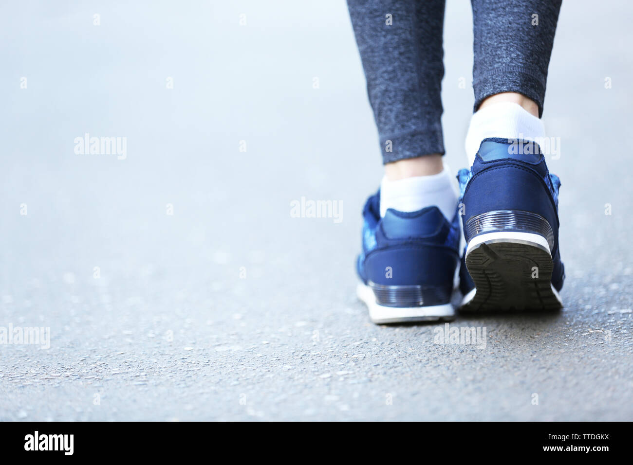 Sports woman legs in running movement Stock Photo - Alamy