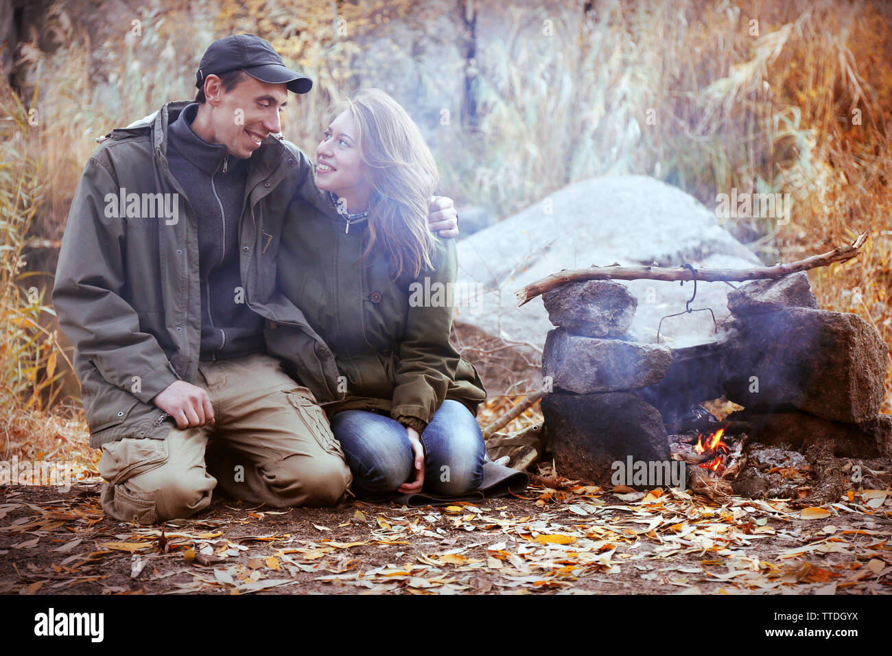 Couple beside fire hi-res stock photography and images - Alamy