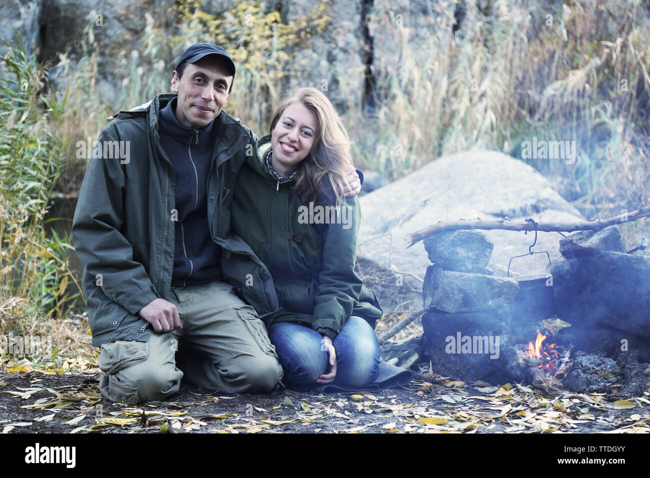Couple beside fire hi-res stock photography and images - Alamy