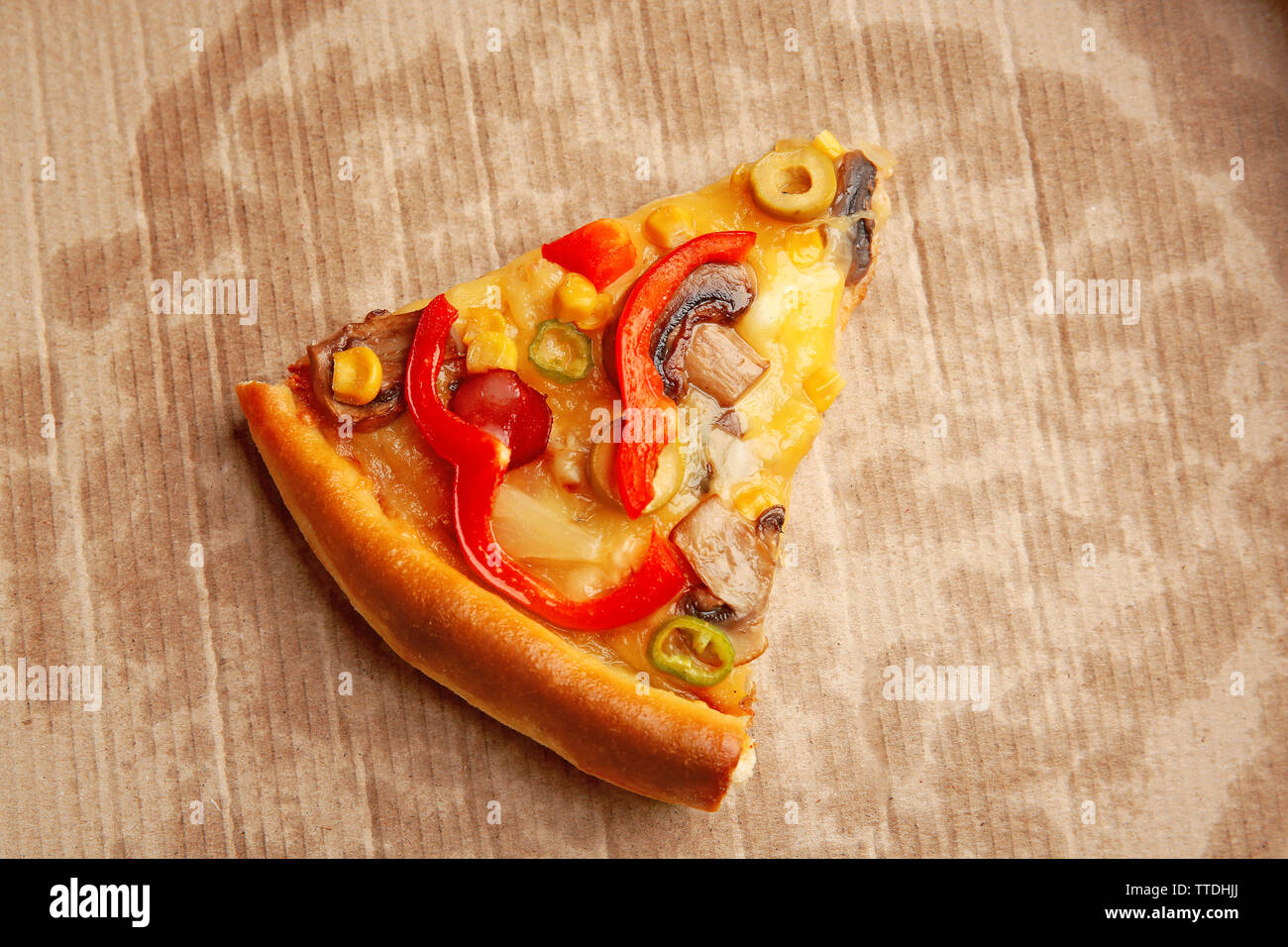 Slice of delicious pizza on cardboard Stock Photo - Alamy