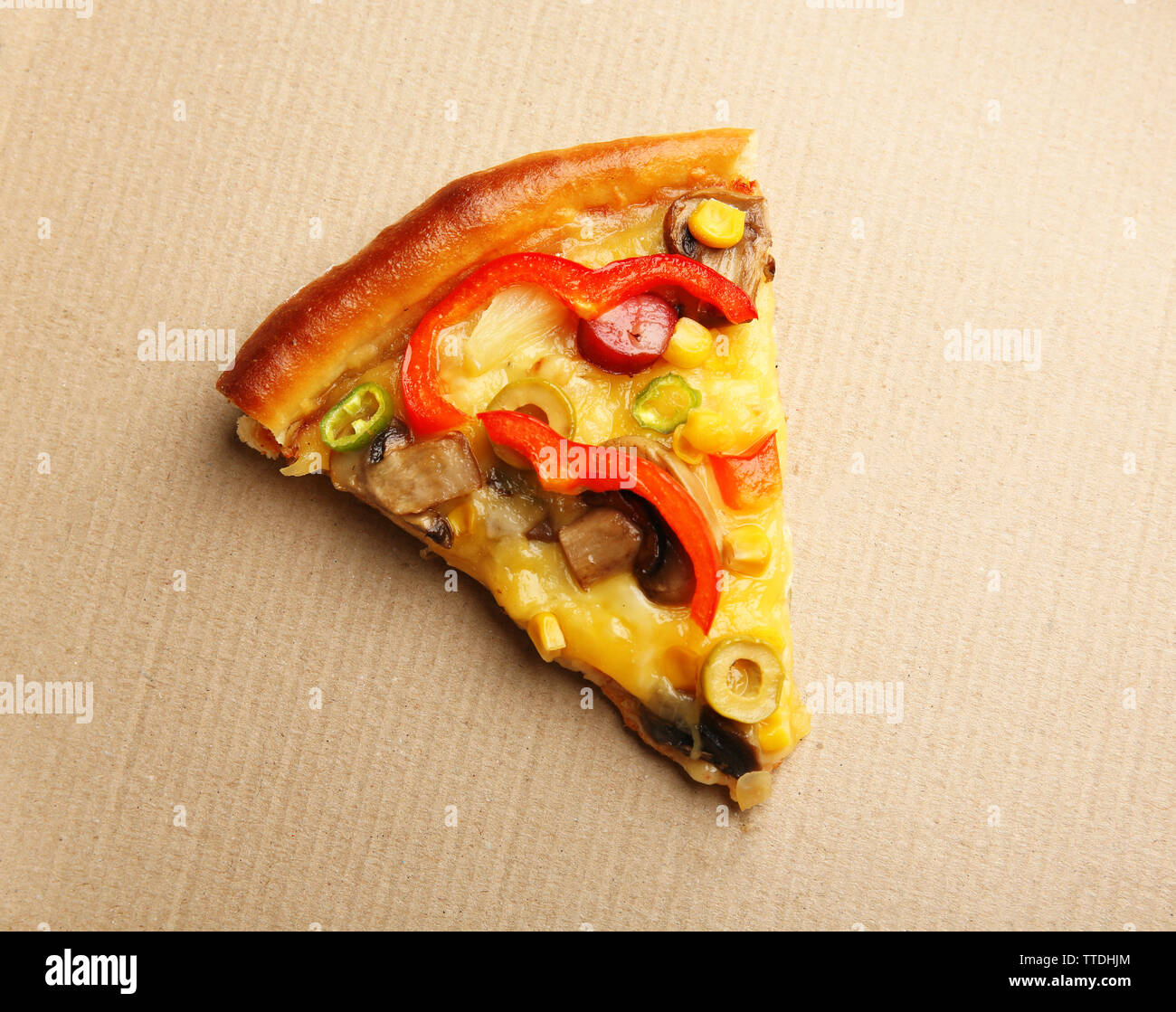 Slice of delicious pizza on cardboard Stock Photo - Alamy