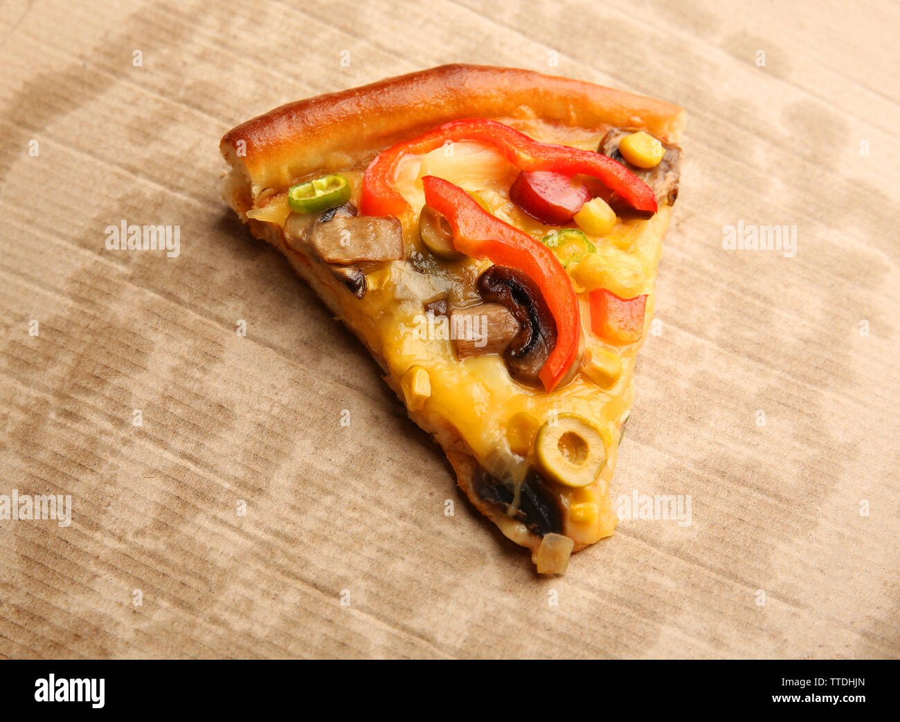 Slice of delicious pizza on cardboard Stock Photo - Alamy