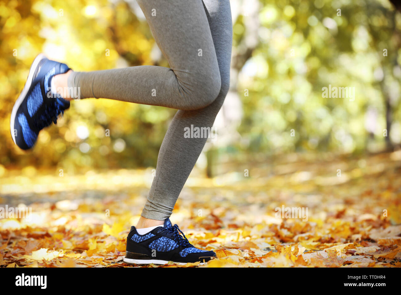 Runner legs outside during autumn day Stock Photo - Alamy