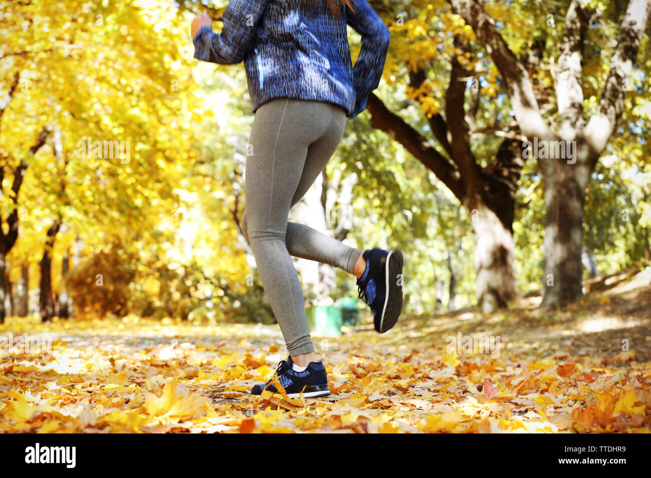 Runner legs outside during autumn day Stock Photo - Alamy