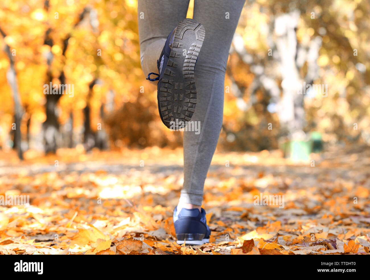 Runner legs outside during autumn day Stock Photo - Alamy