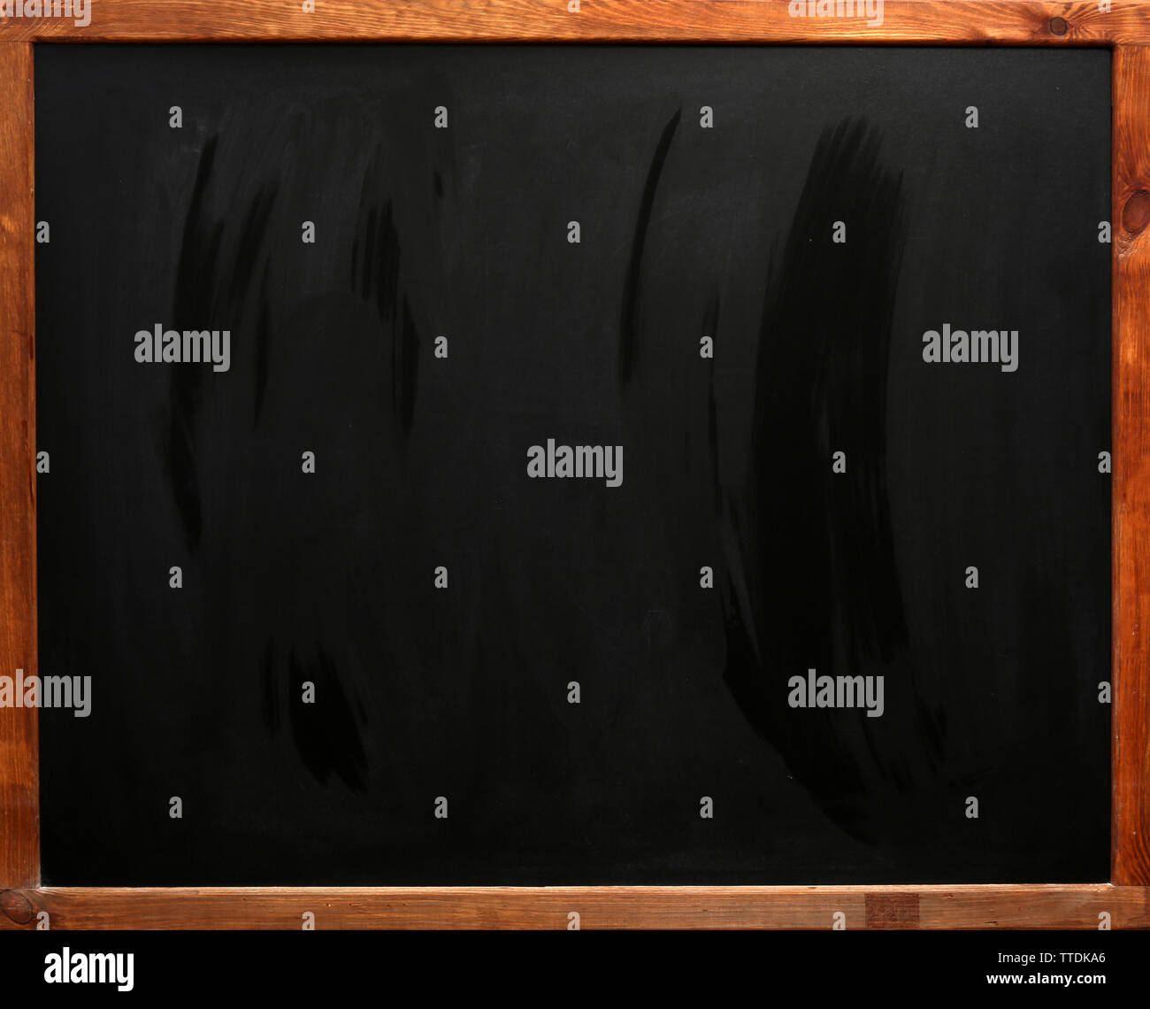 Clean blackboard on white wall, close-up Stock Photo - Alamy