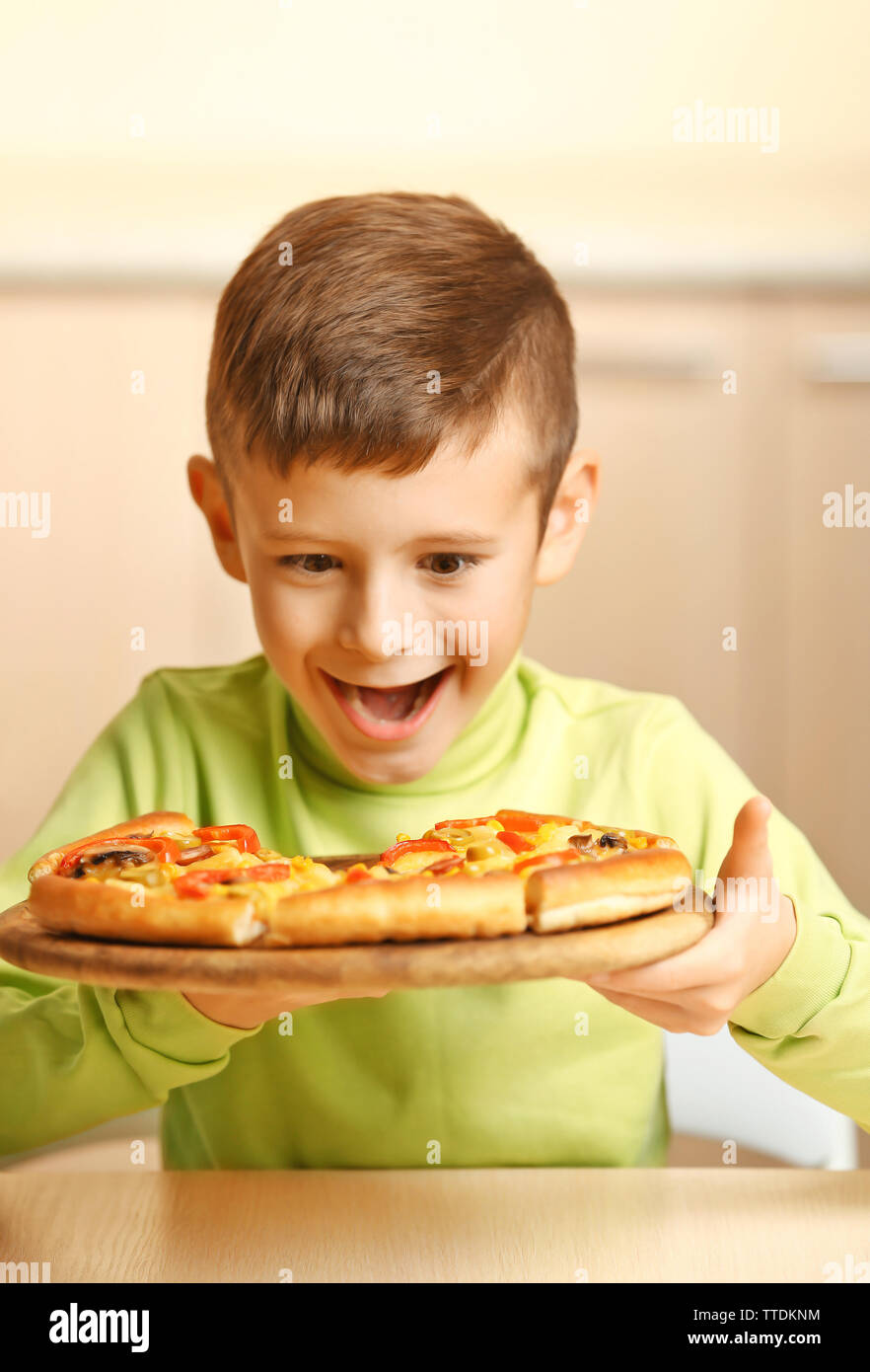 Boy eating pizza hi-res stock photography and images - Alamy